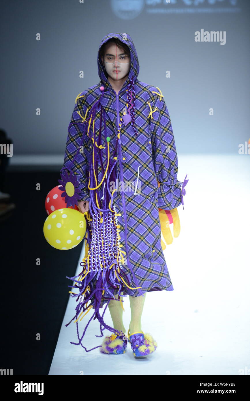 A model displays a new creation featuring traditional Chinese elements ...