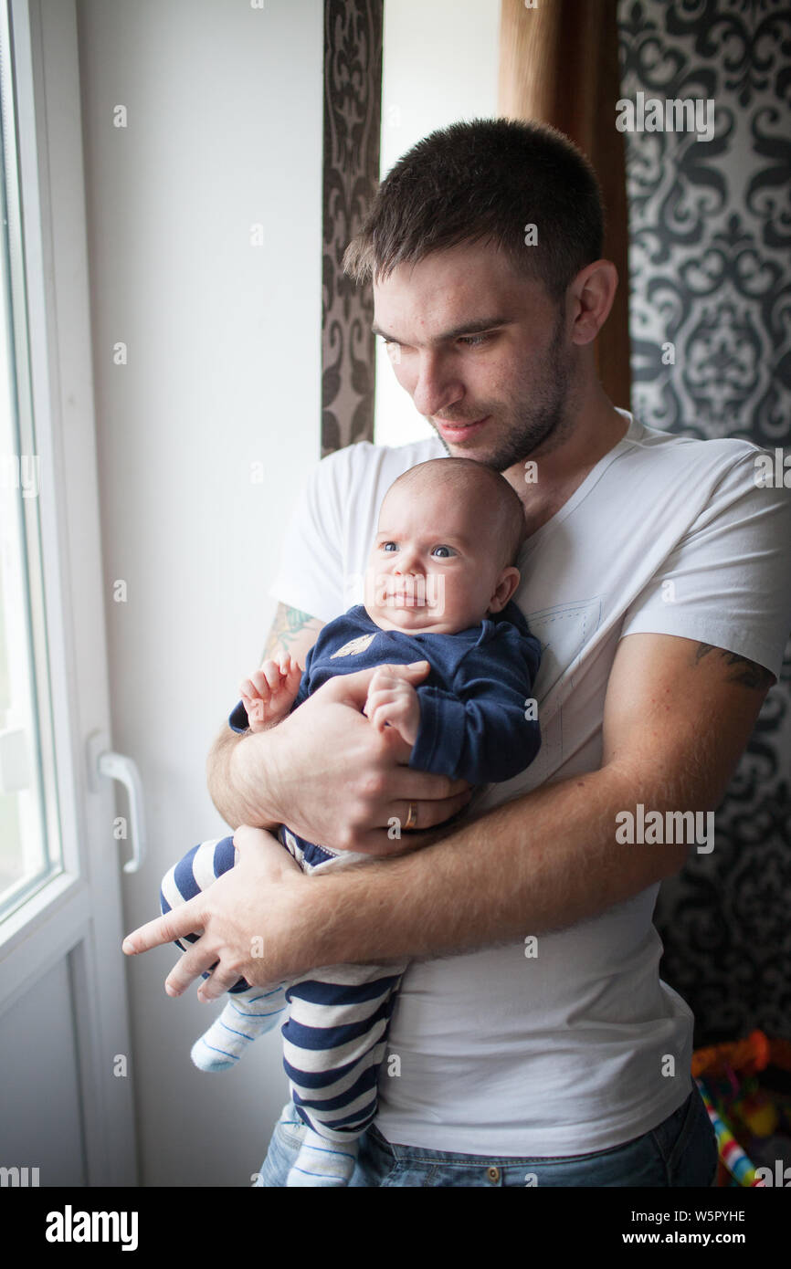 Father holding his little baby Stock Photo - Alamy