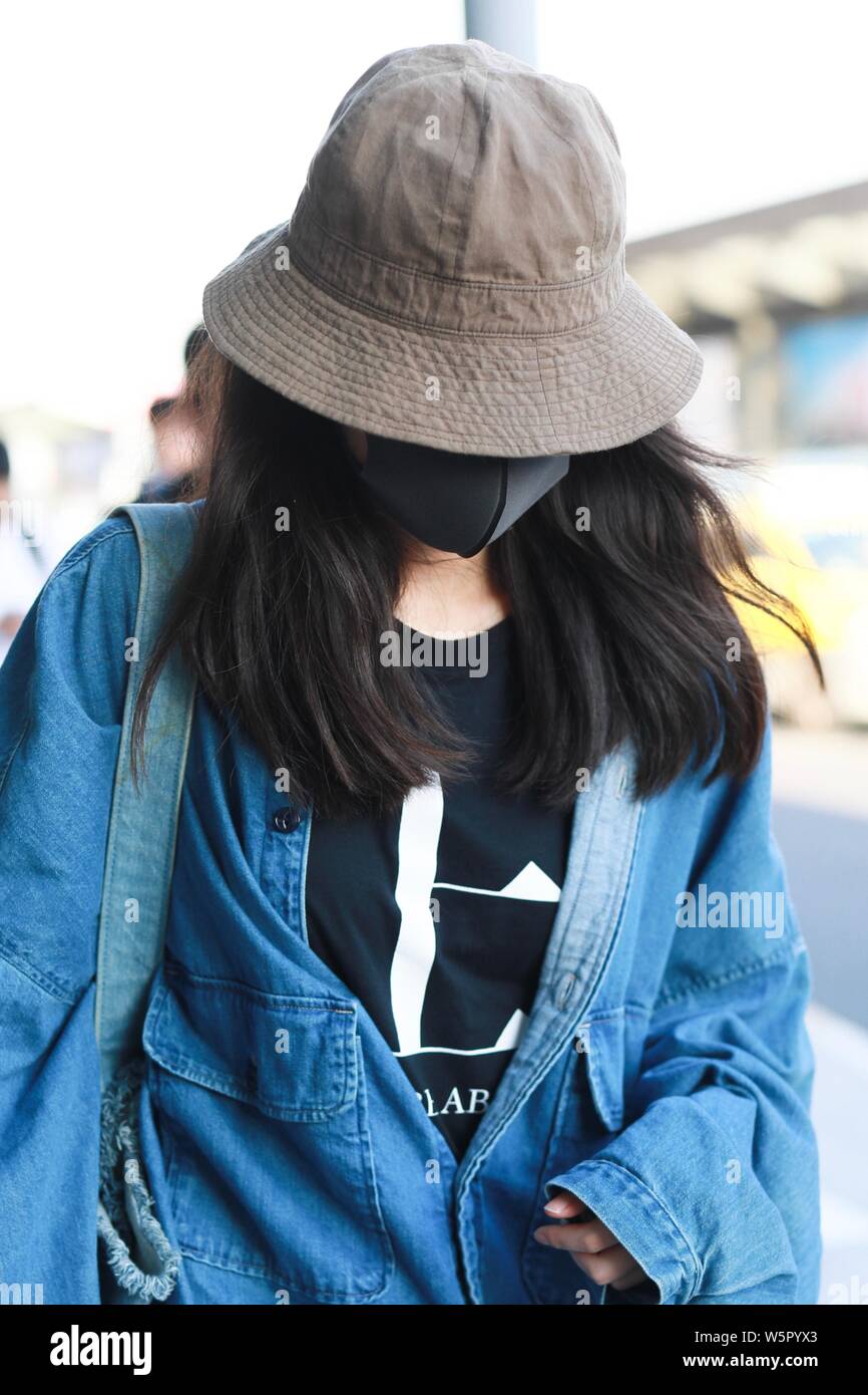 Chinese actress Ni Ni arrives at the Beijing Capital International ...