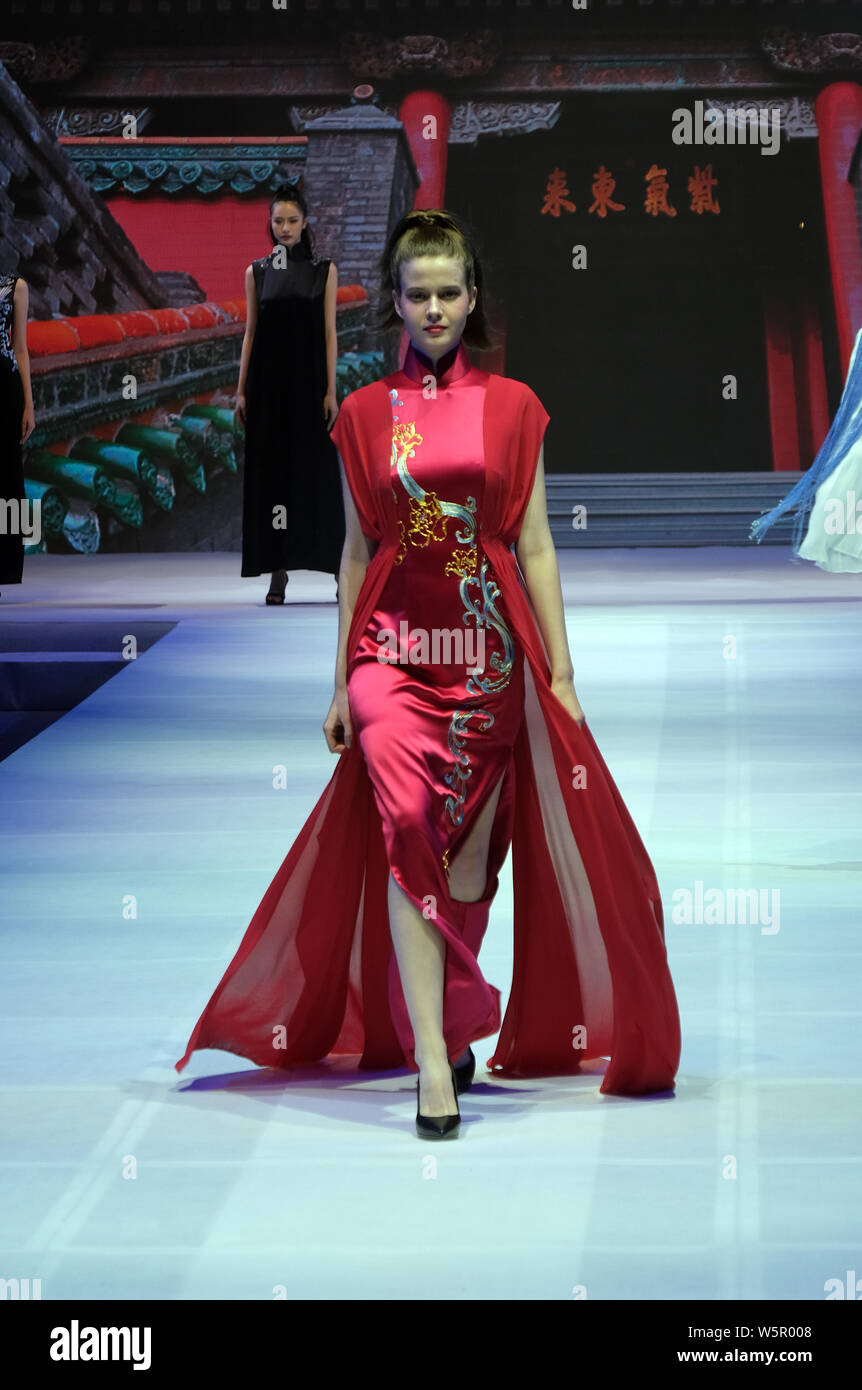 A model dressed in Cheongsam, a traditional Chinese dresses also known ...