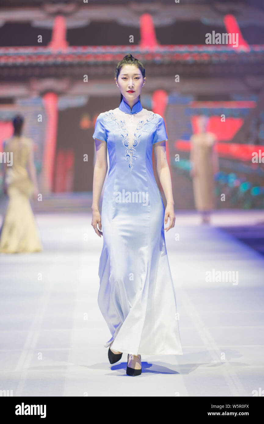 A model dressed in Cheongsam, a traditional Chinese dresses also known ...