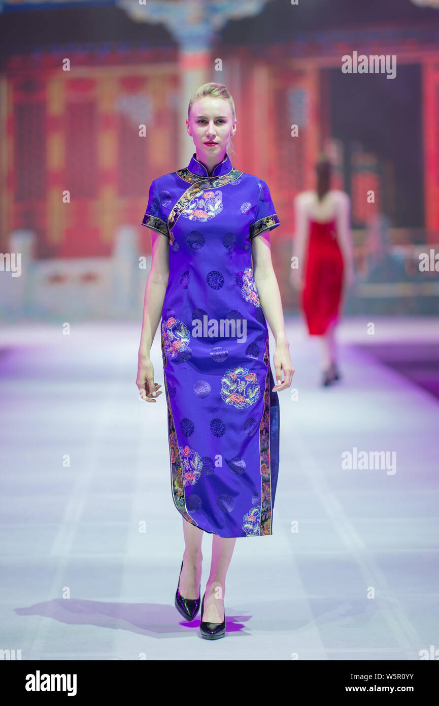 A model dressed in Cheongsam, a traditional Chinese dresses also known ...