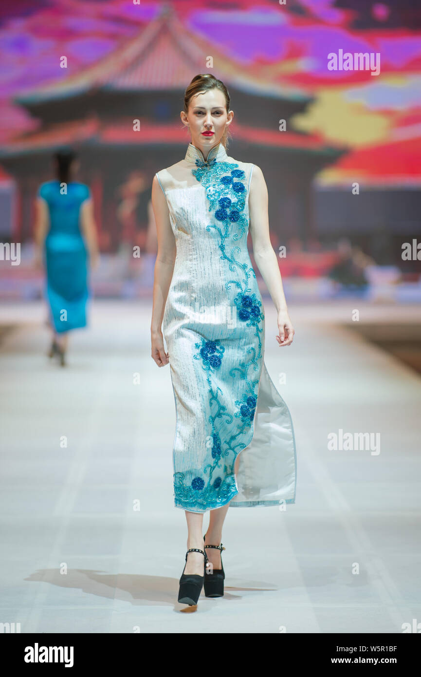 A model dressed in Cheongsam, a traditional Chinese dresses also known ...