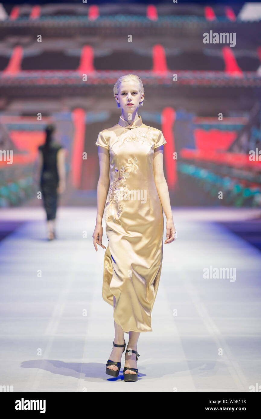 A model dressed in Cheongsam, a traditional Chinese dresses also known ...