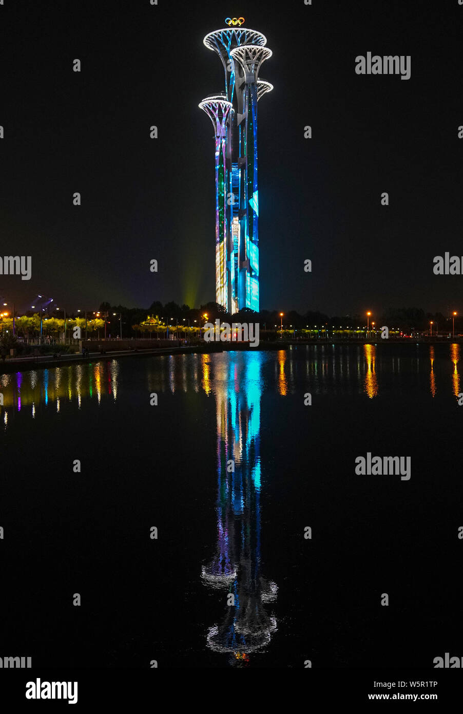 The watchtower at Olympic Forest Park is illuminated by colorful lights ...