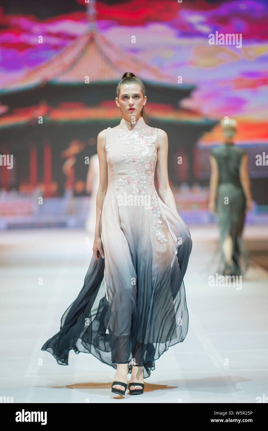 A model dressed in Cheongsam, a traditional Chinese dresses also known ...