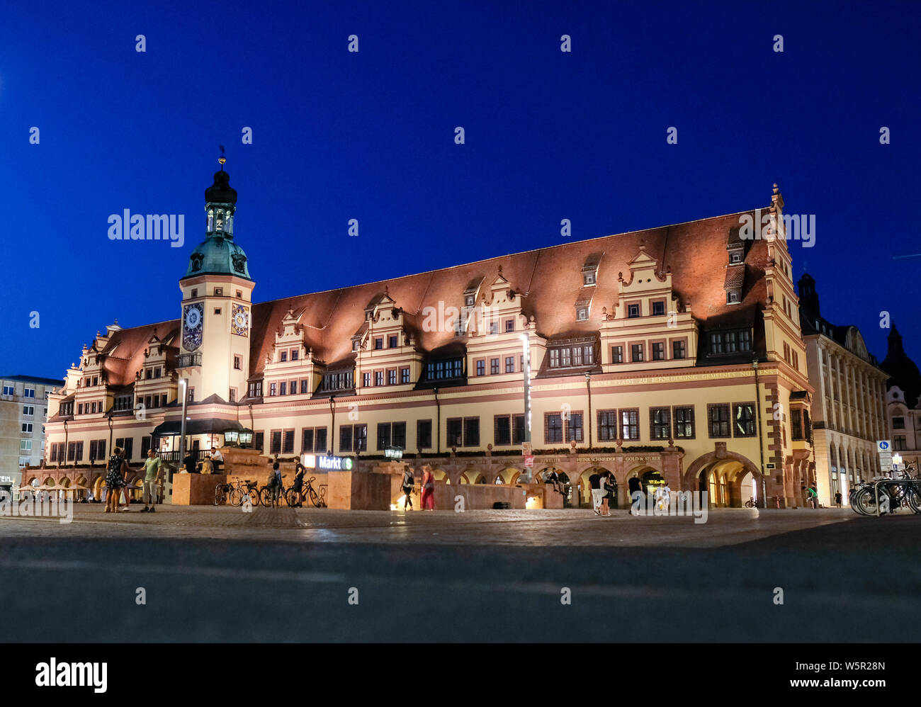 Leipzig, Germany. 25th July, 2019. In the evening passers-by walk past ...