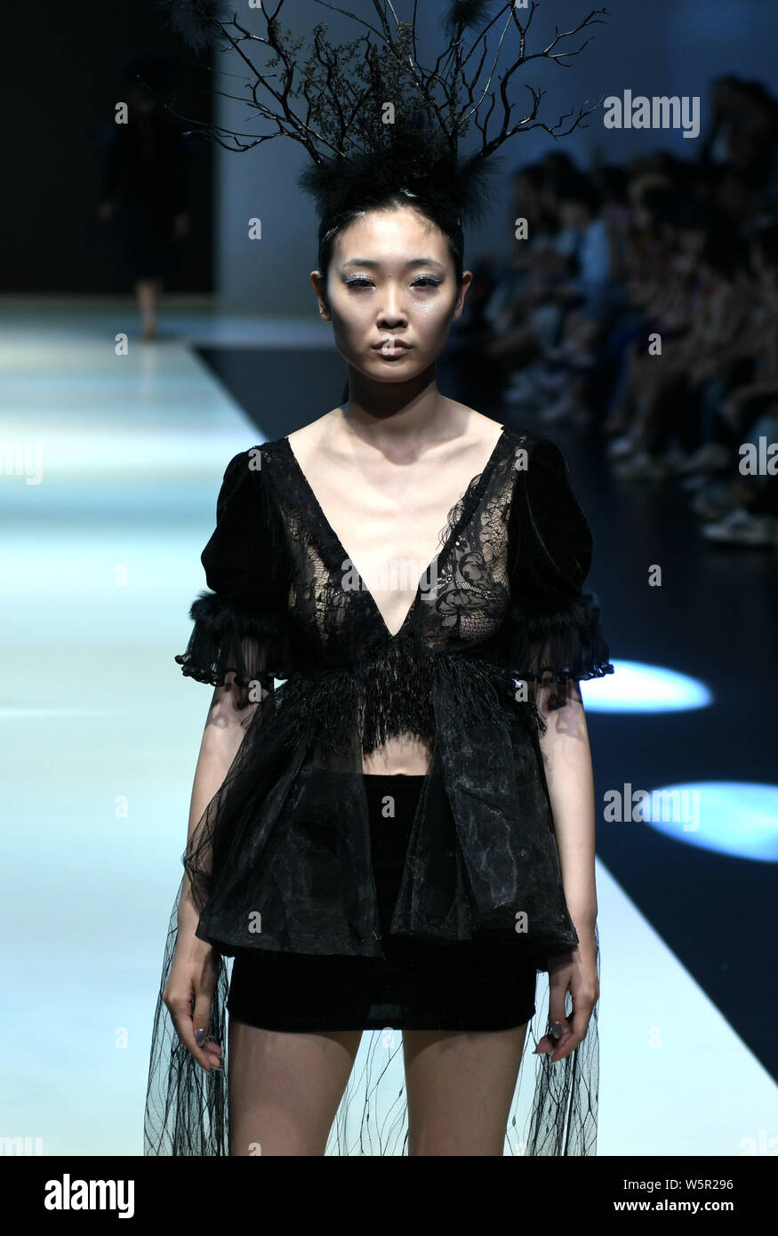 A model displays a new creation featuring traditional Chinese elements ...
