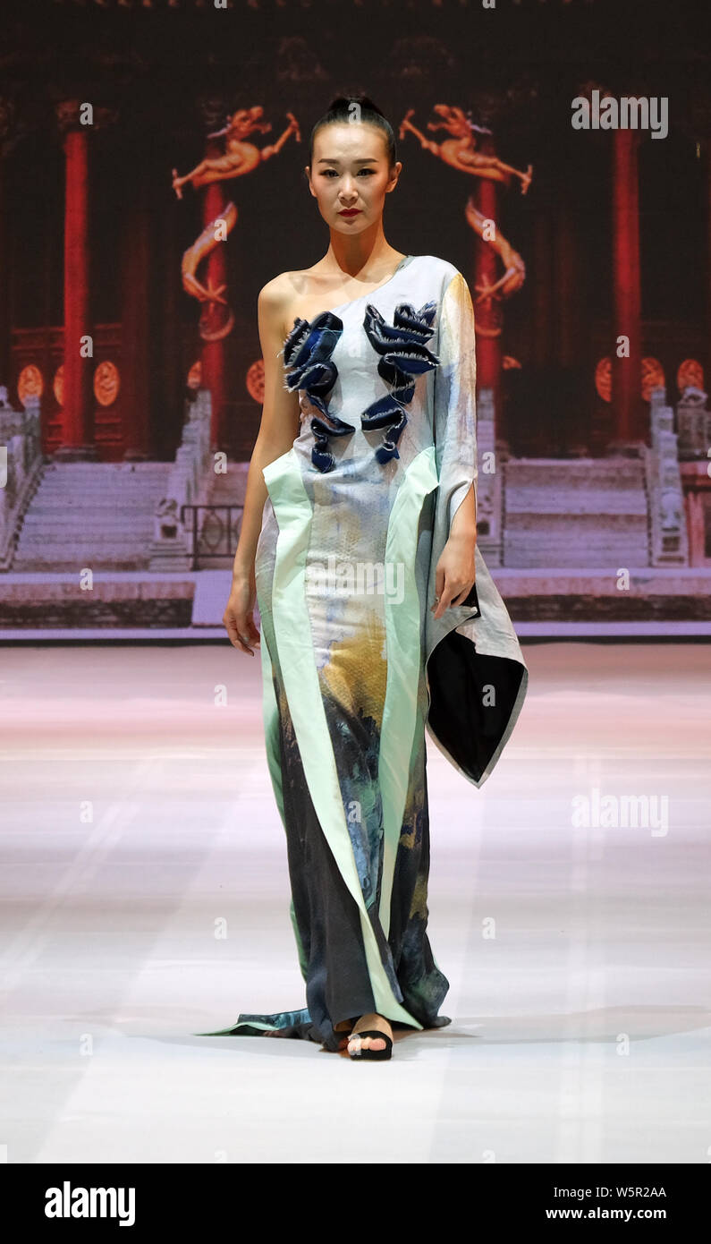 A model dressed in Cheongsam, a traditional Chinese dresses also known ...