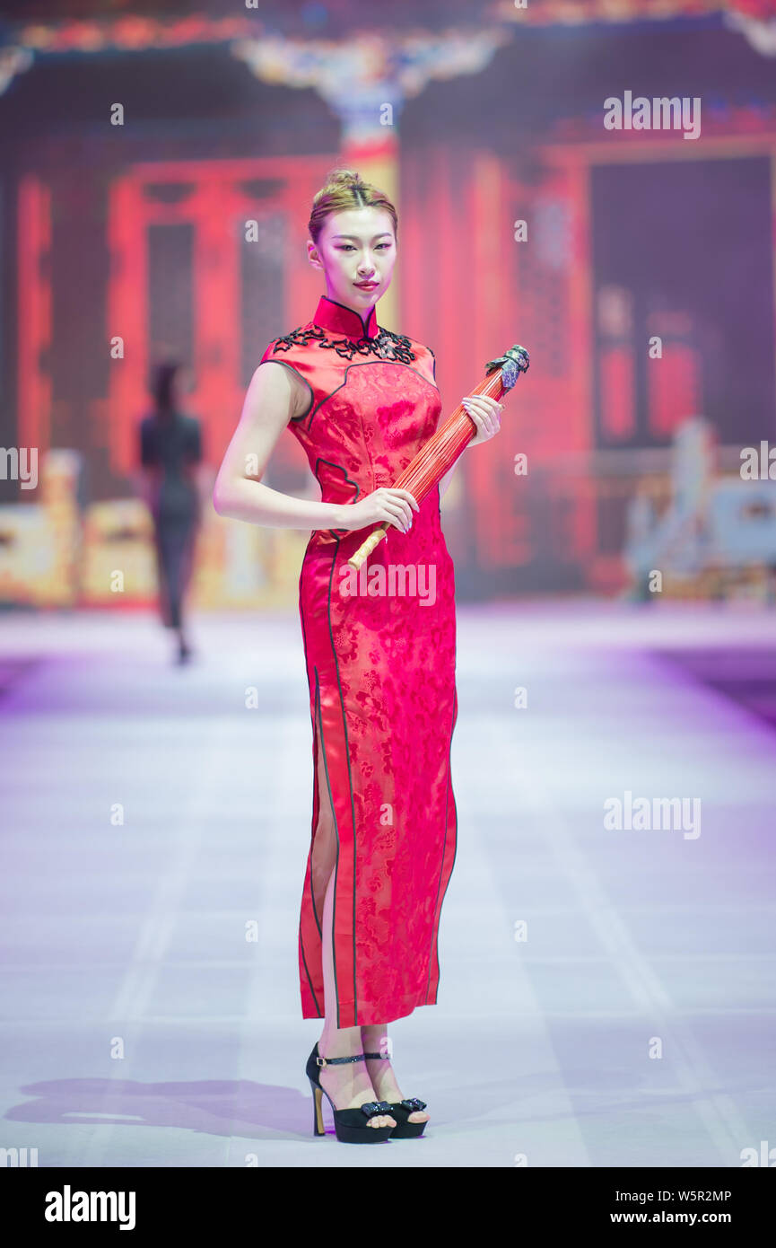 A model dressed in Cheongsam, a traditional Chinese dresses also known ...