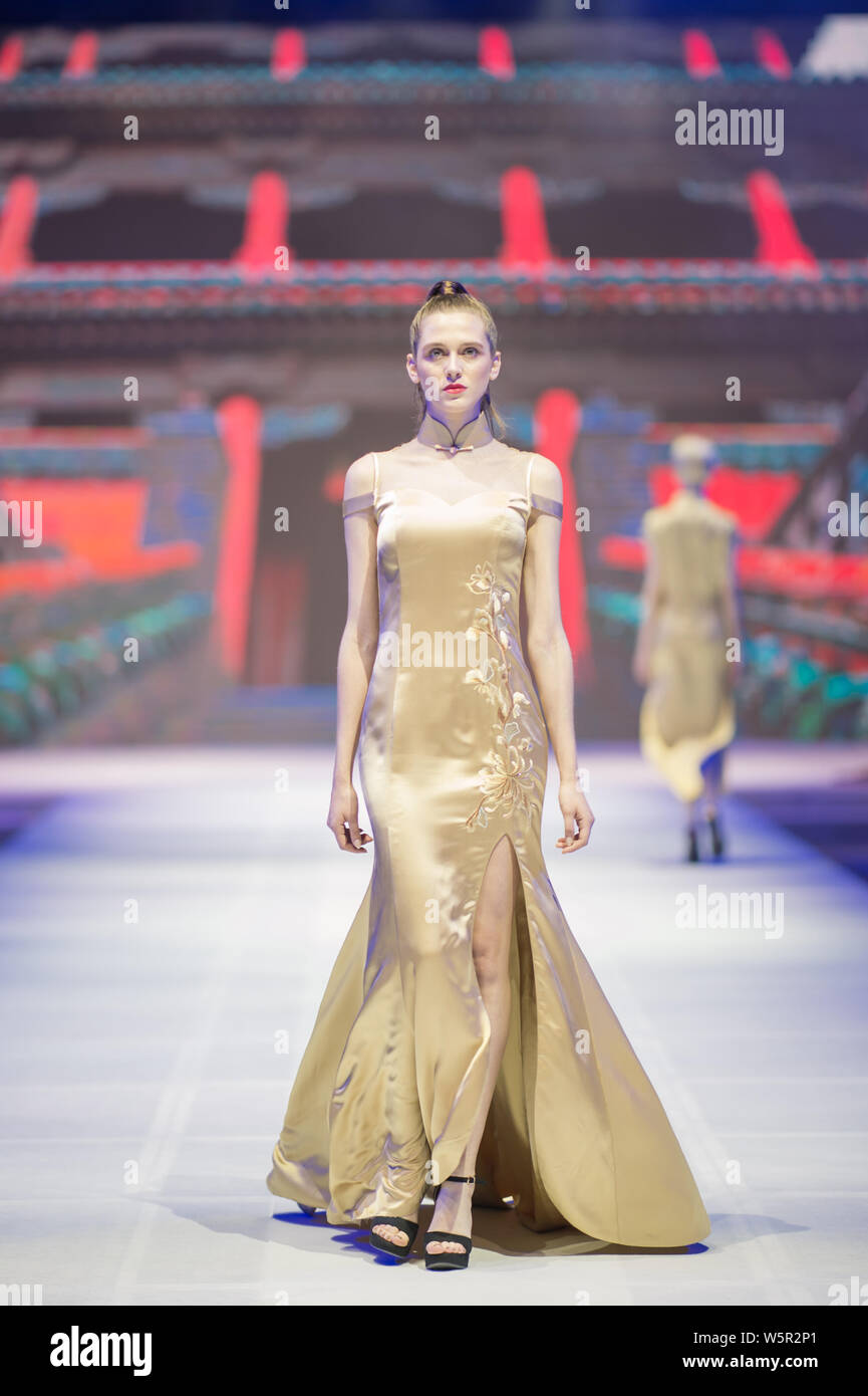 A model dressed in Cheongsam, a traditional Chinese dresses also known ...