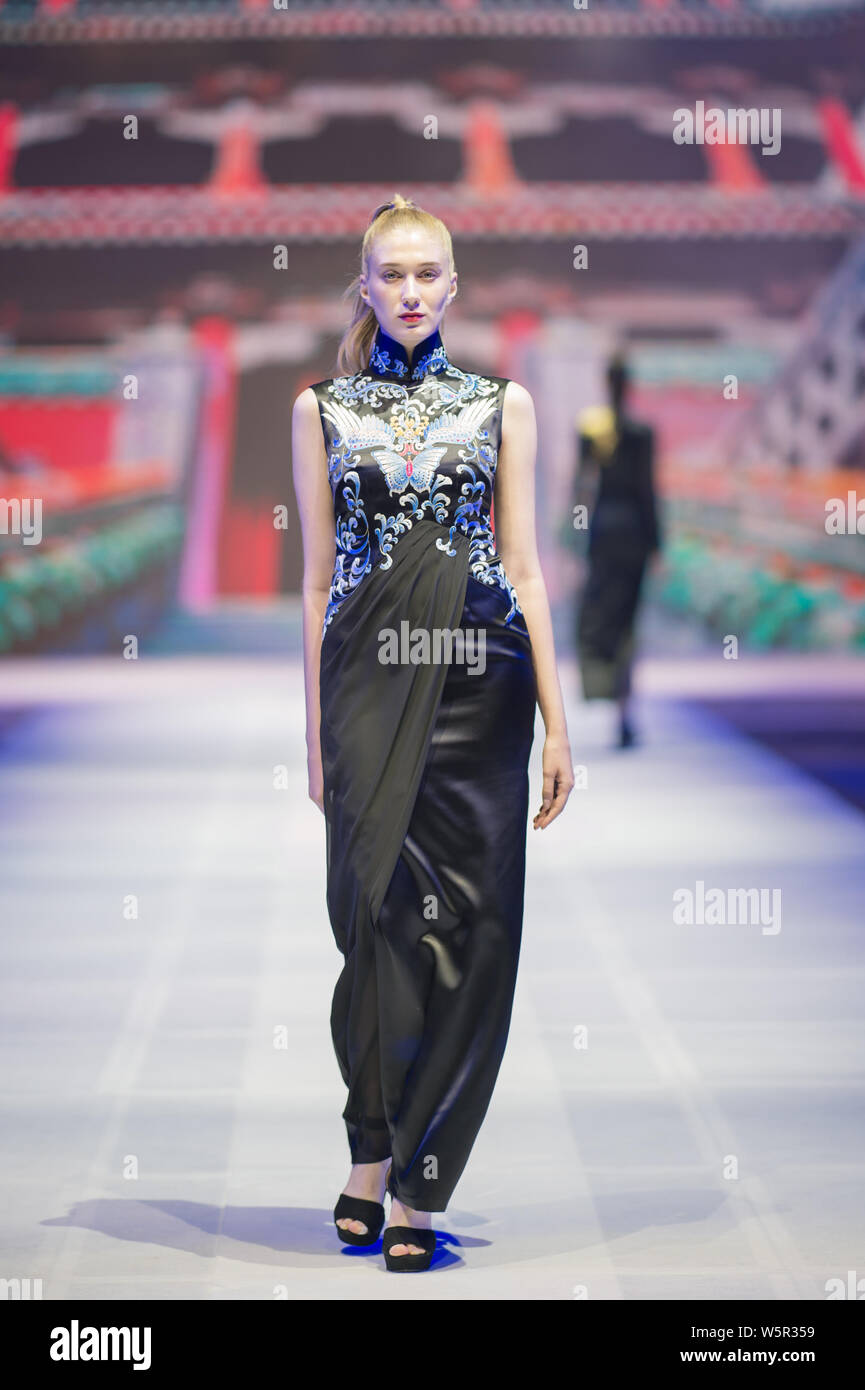 A model dressed in Cheongsam, a traditional Chinese dresses also known ...