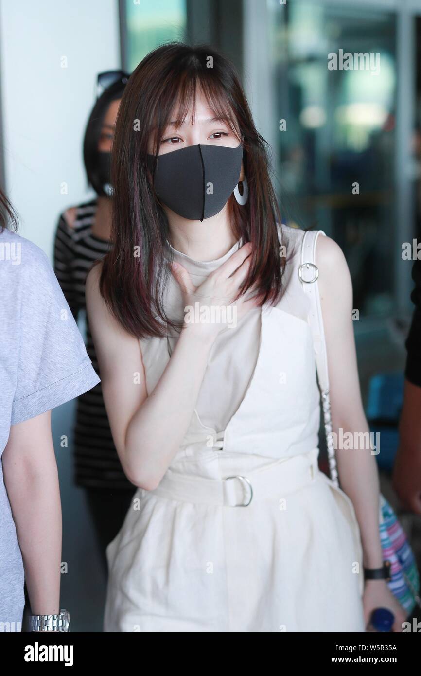 Taiwanese singer and actress Cyndi Wang is seen wearing a face mask ...