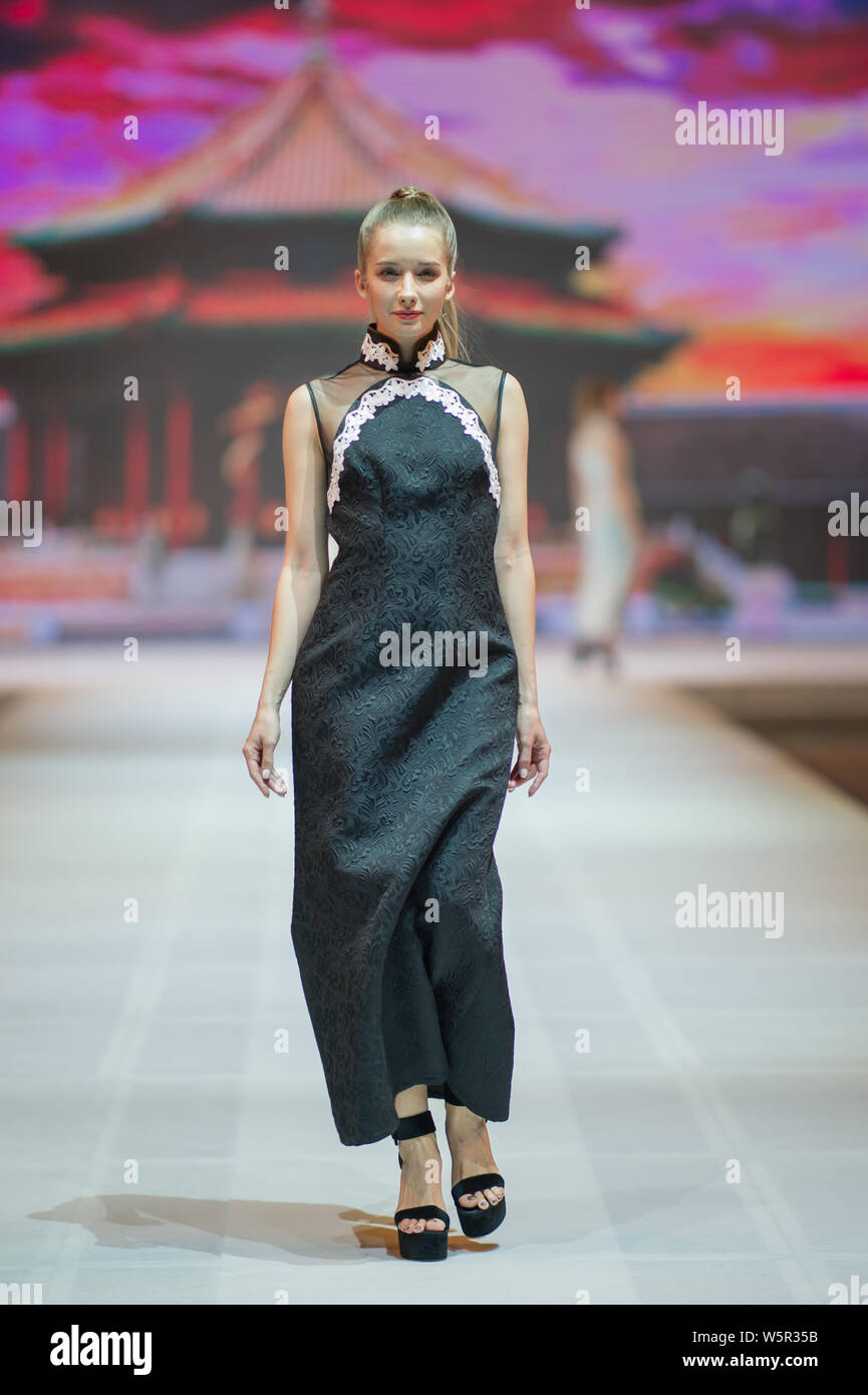 A model dressed in Cheongsam, a traditional Chinese dresses also known ...