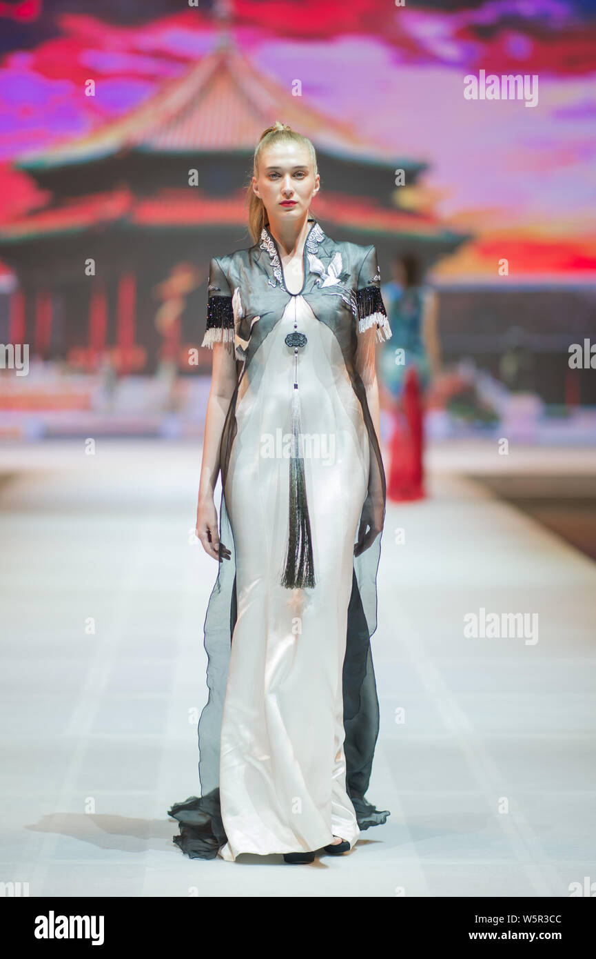 A model dressed in Cheongsam, a traditional Chinese dresses also known ...