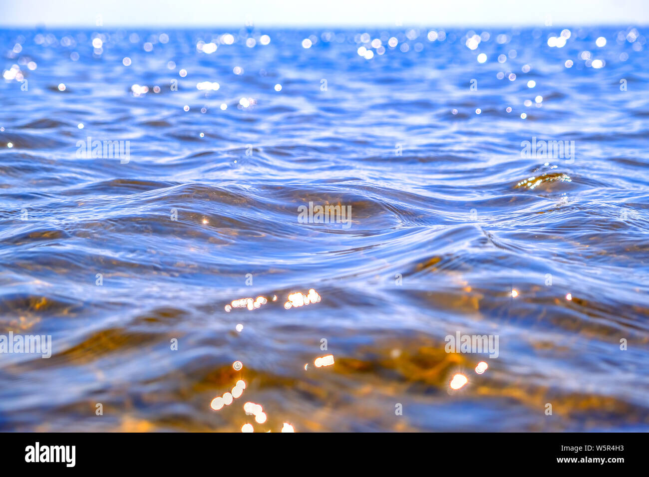 Shine of sea waves. Blue sea water surface. Reflection of sunlight in ...
