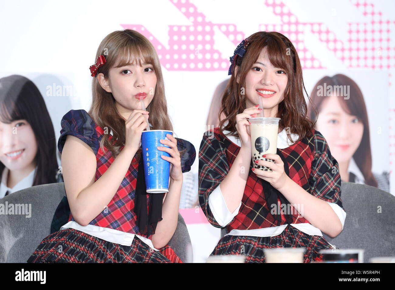Rena Kato, left, and Ma Chia-ling of Japanese female idol group AKB48 ...