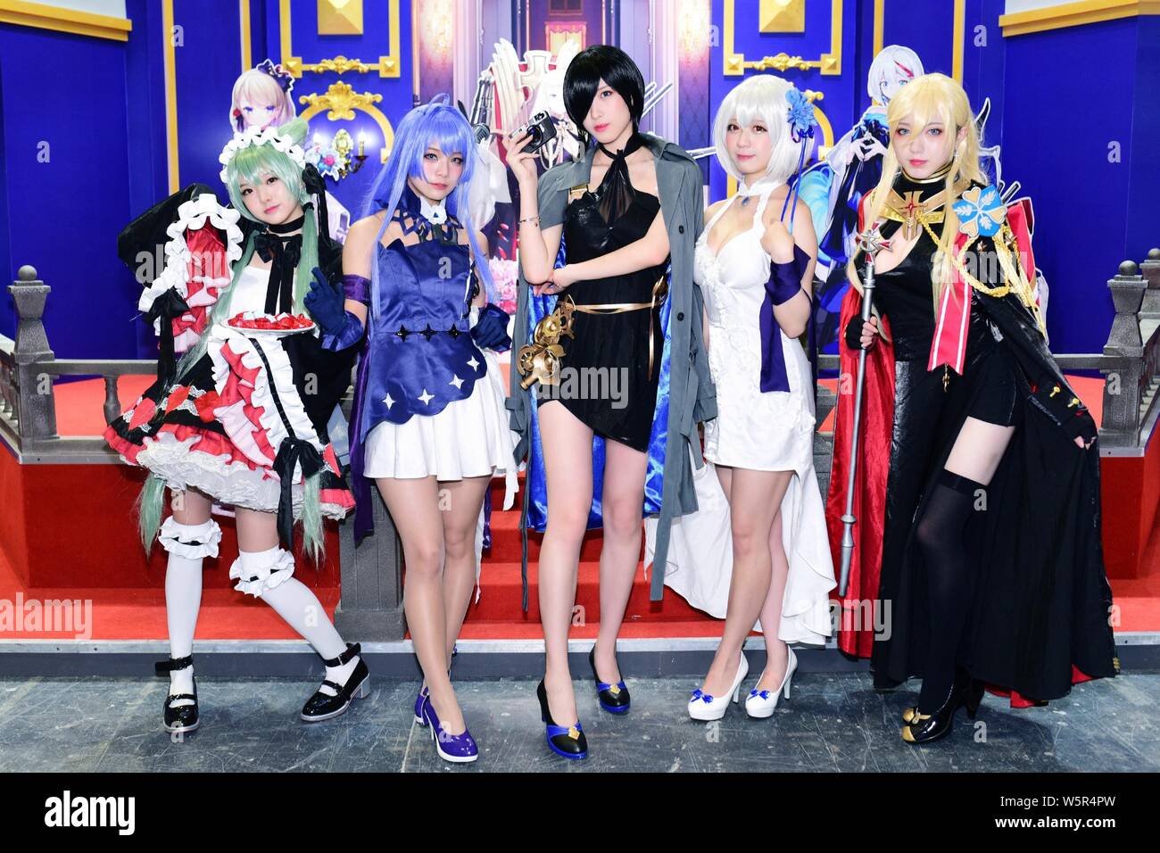 Entertainers dressed in cosplay costumes pose during the Shanghai ...