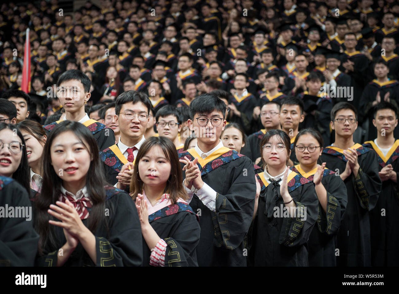 University undergraduates in gowns hi-res stock photography and images ...