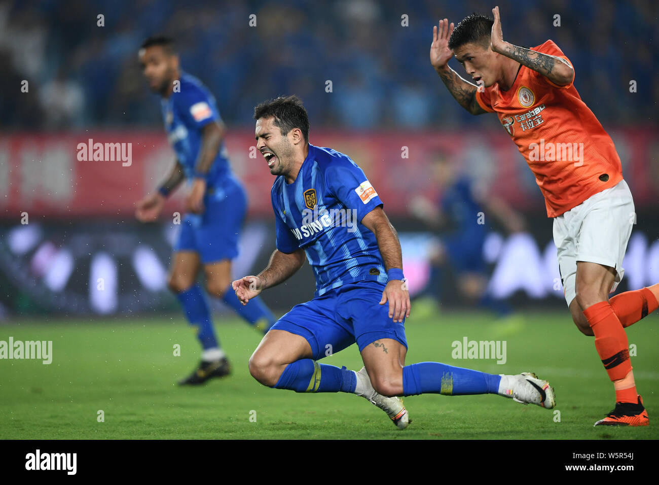 A player of Beijing Renhe challenges Italian-Brazilian football player ...