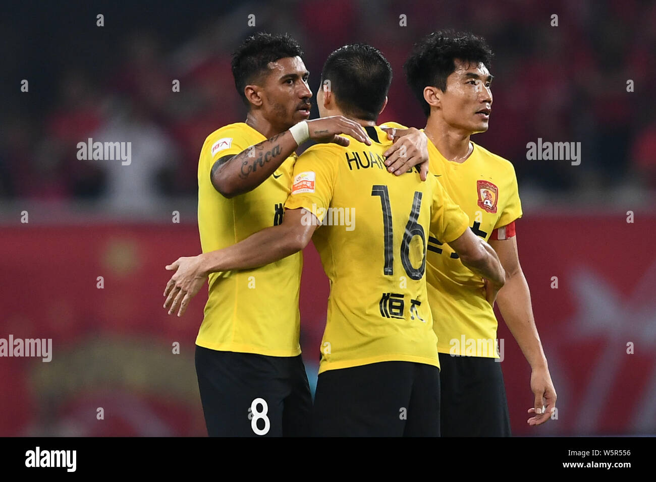 Brazilian football player Paulinho, left, of Guangzhou Evergrande ...