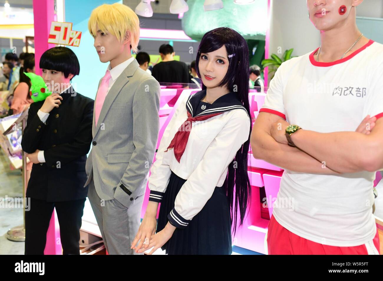 Entertainers dressed in cosplay costumes pose during the Shanghai ...