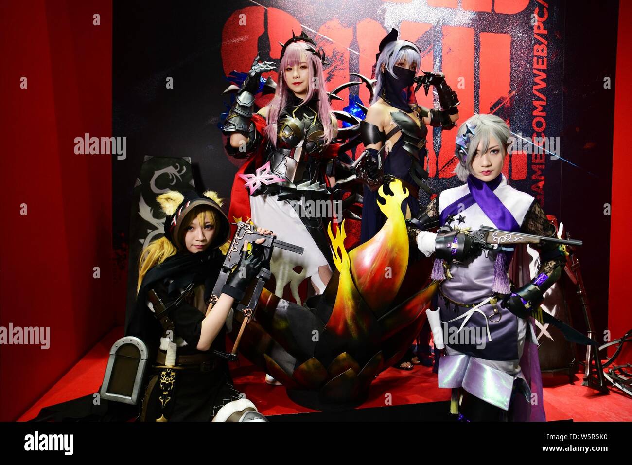 Entertainers dressed in cosplay costumes pose during the Shanghai ...