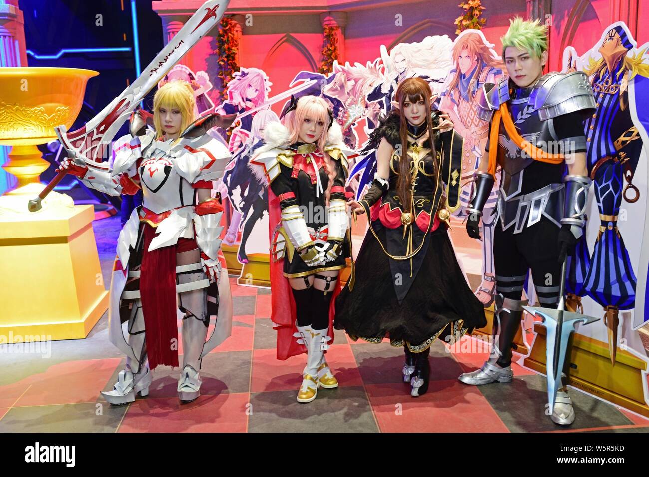 Entertainers dressed in cosplay costumes pose during the Shanghai COMICUP 24 Cosplay Showcase in ...