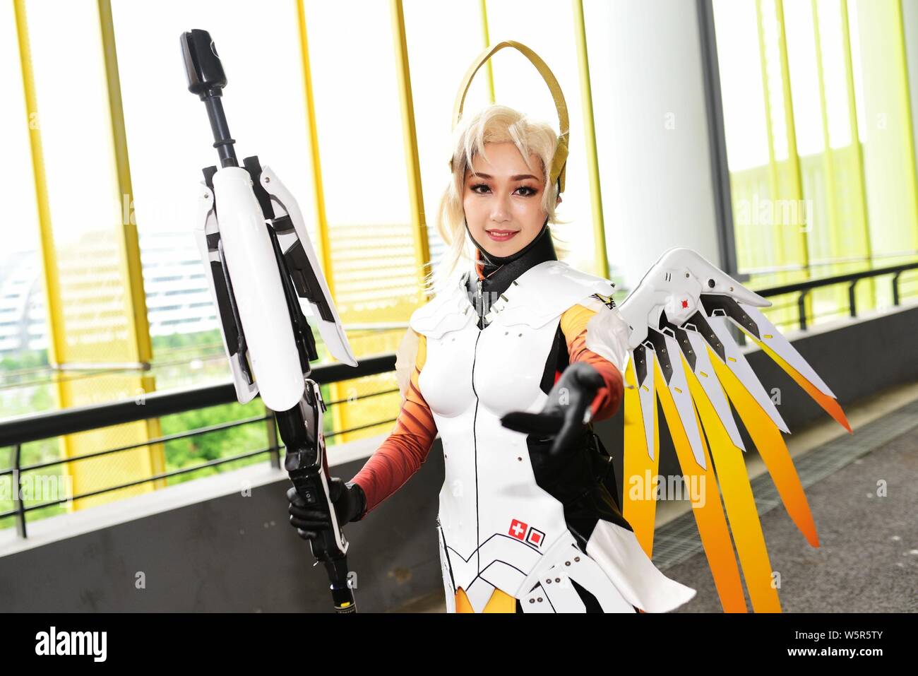 An entertainer dressed in cosplay costume poses during the Shanghai ...
