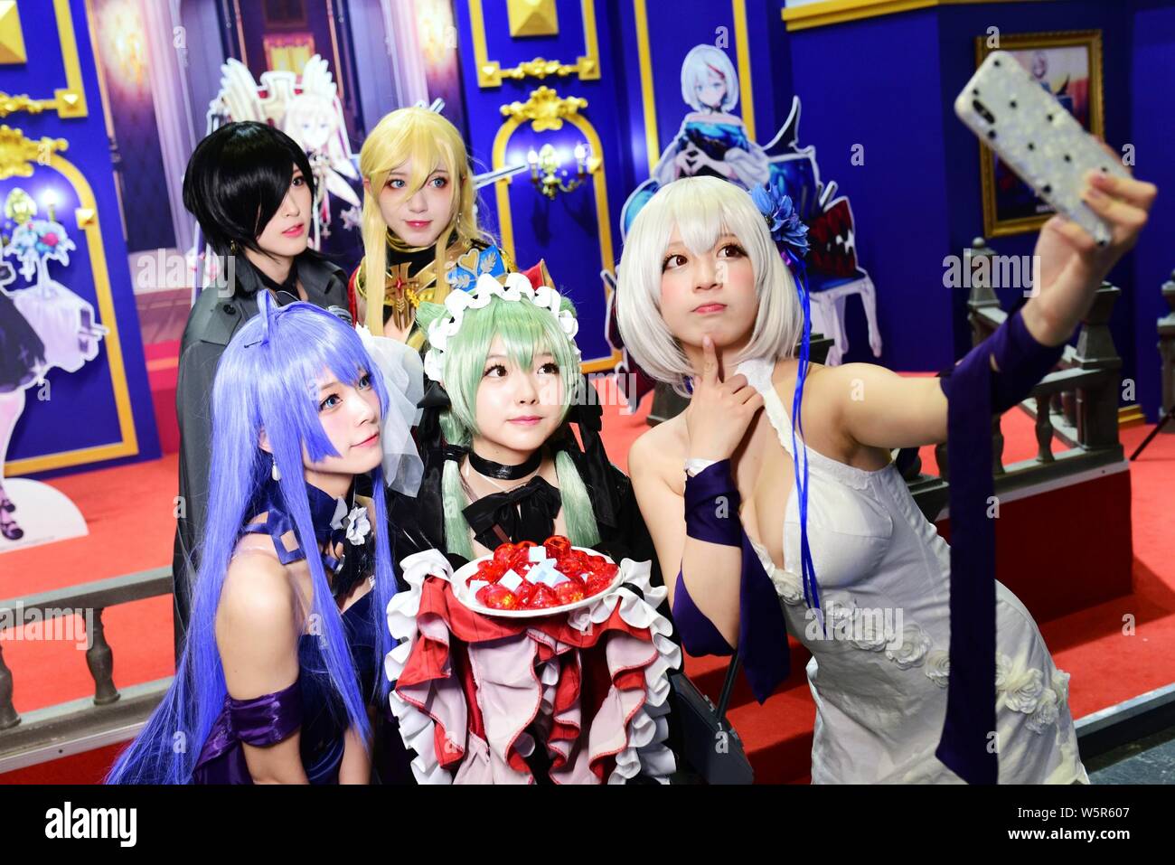 Entertainers dressed in cosplay costumes pose during the Shanghai ...