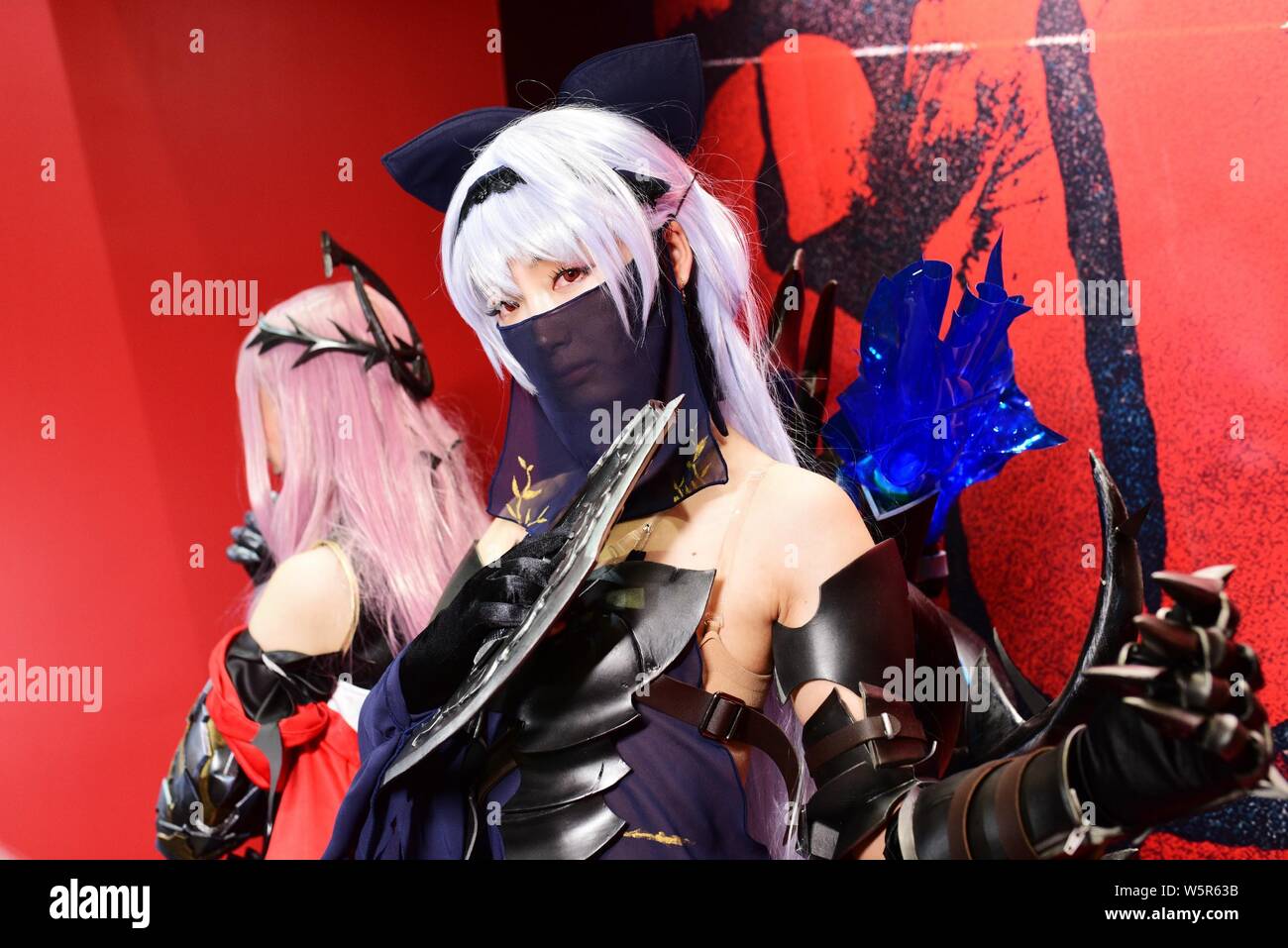 An entertainer dressed in cosplay costume poses during the Shanghai COMICUP 24 Cosplay Showcase ...