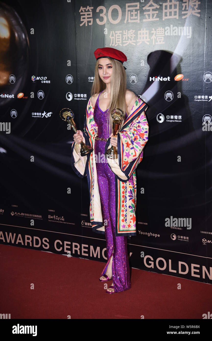 Taiwanese singer Jolin Tsai poses with her trophies after winning ...