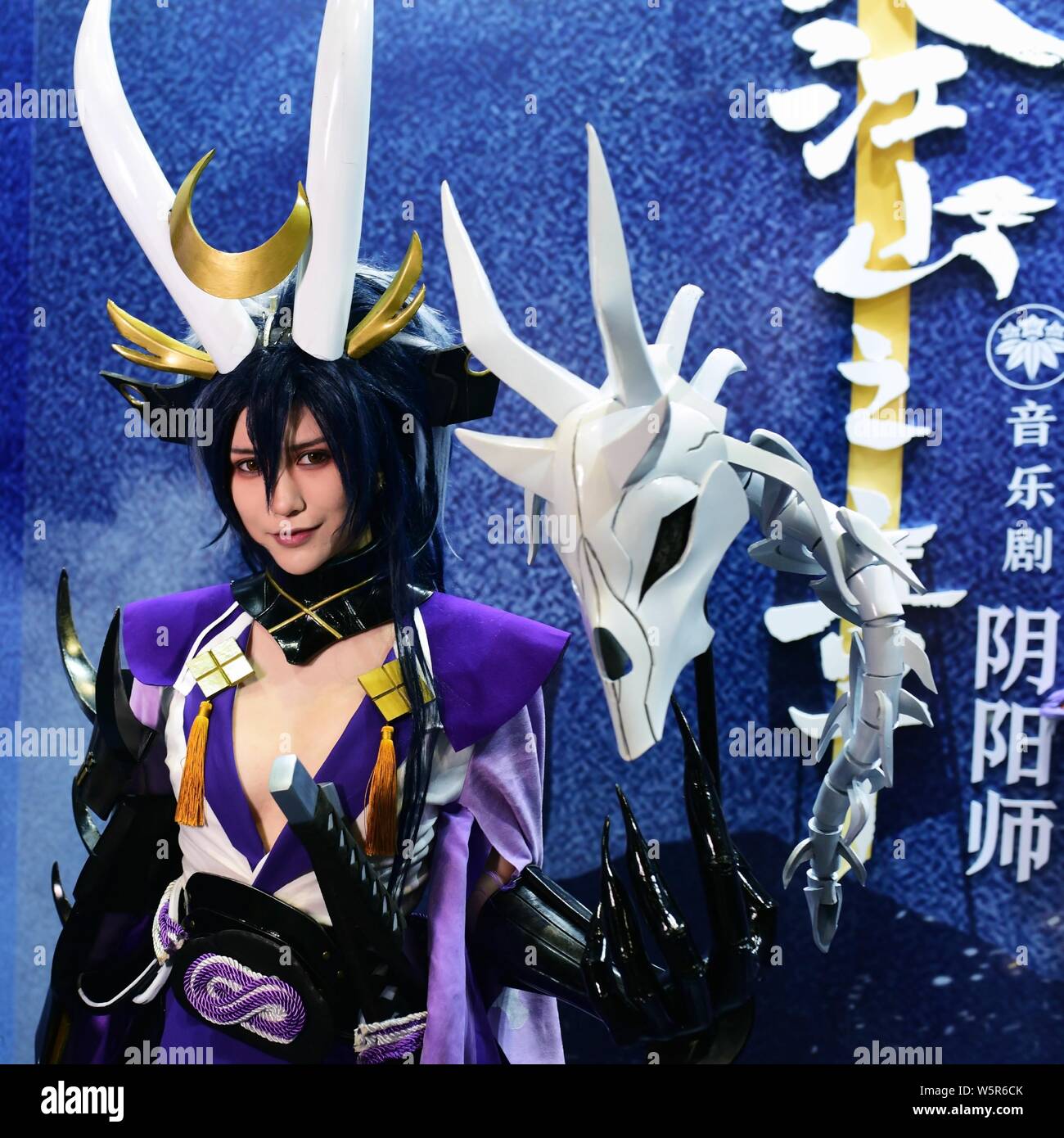 An entertainer dressed in cosplay costume poses during the Shanghai ...