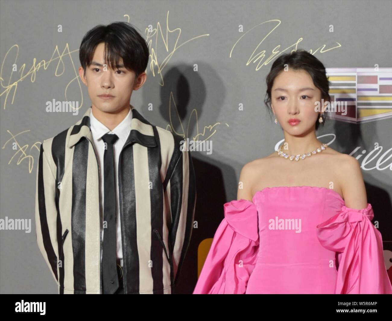 Jackson Yee or Yi Yangqianxi of Chinese boy group TFBoys, left, and ...