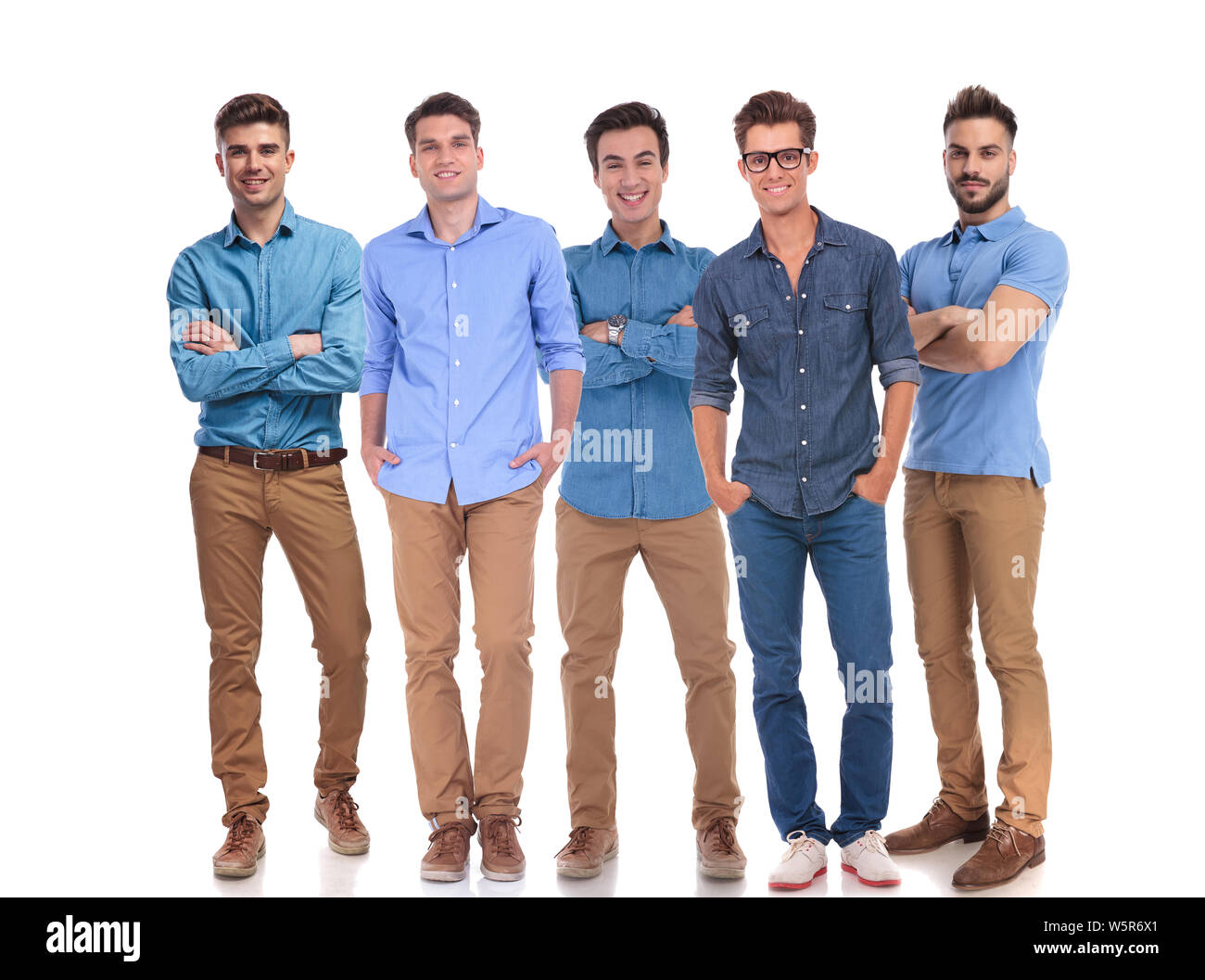 five young casual men standing together at work on white background ...
