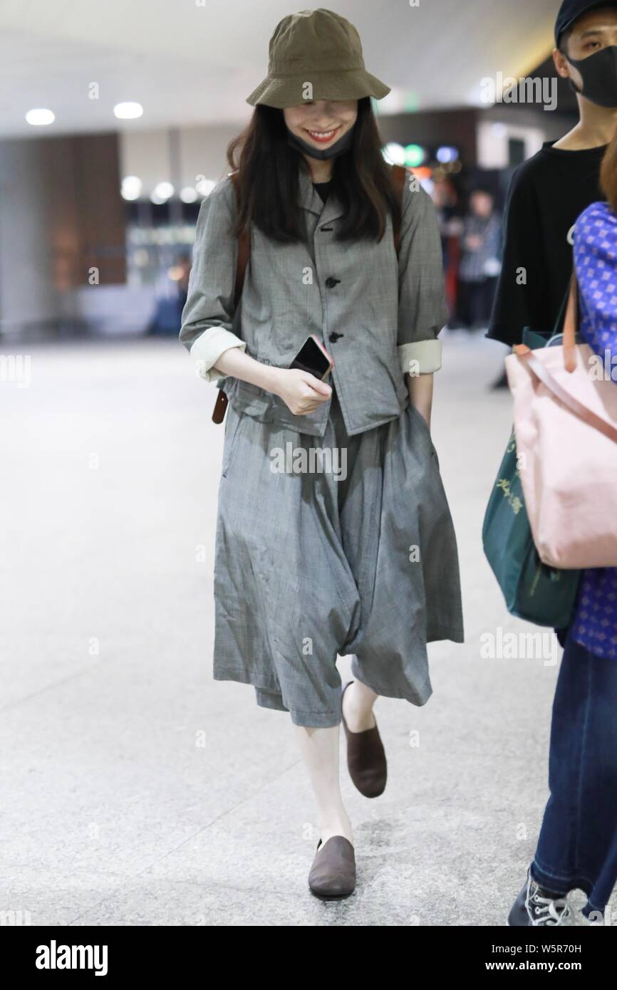 Chinese actress Ni Ni arrives at the Shanghai Hongqiao International ...