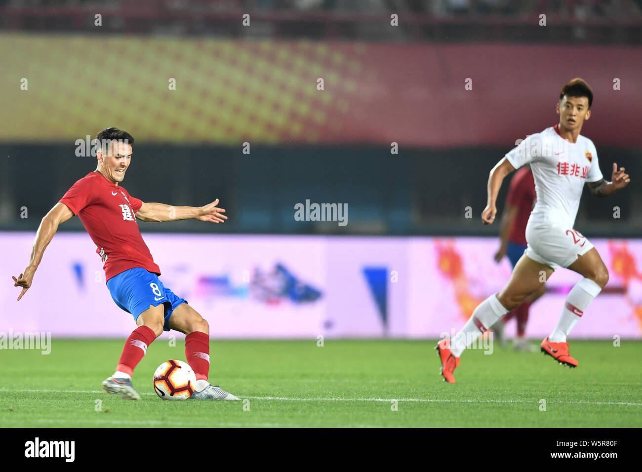 English-born Taiwanese football player Tim Chow, left, of Henan Jianye ...