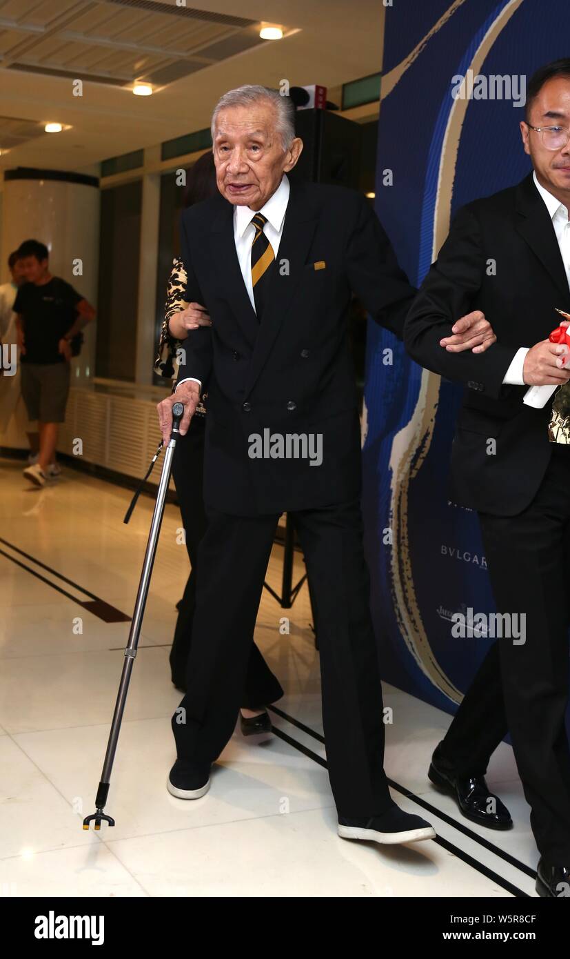 96-year-old Chinese actor Chang Feng poses with his trophy after ...