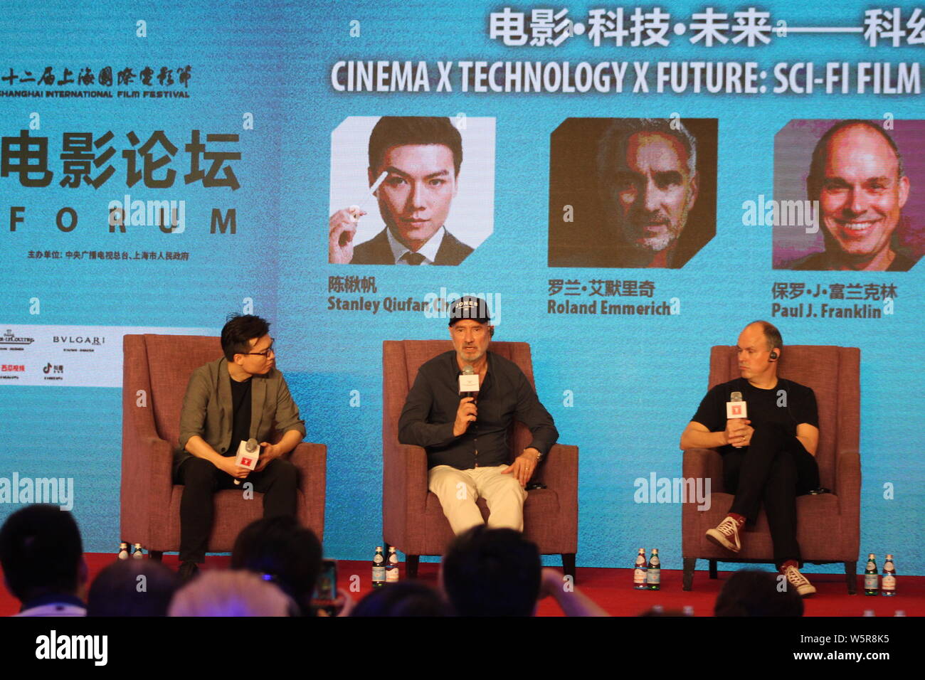German film director Roland Emmerich, center, and English visual ...