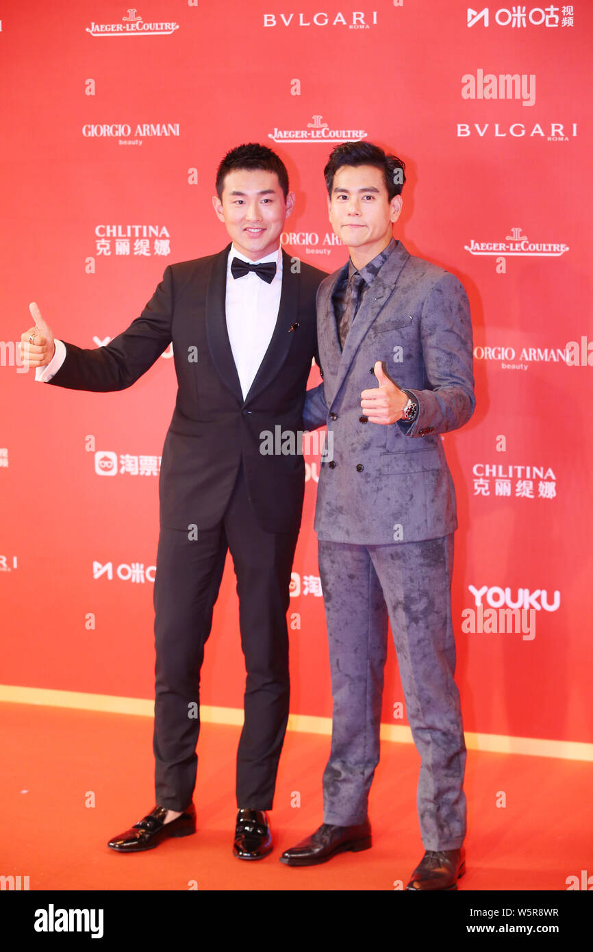 Taiwanese actor Eddie Peng, right, and Chinese actor Wang Yanlin arrive on the red carpet for ...