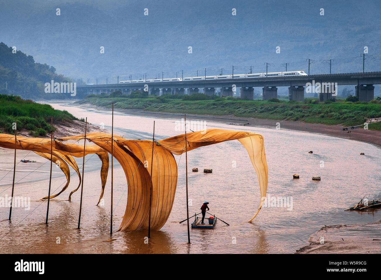 Chinese fishermen labor at the Xiapu intertidal zone, which is China's ...