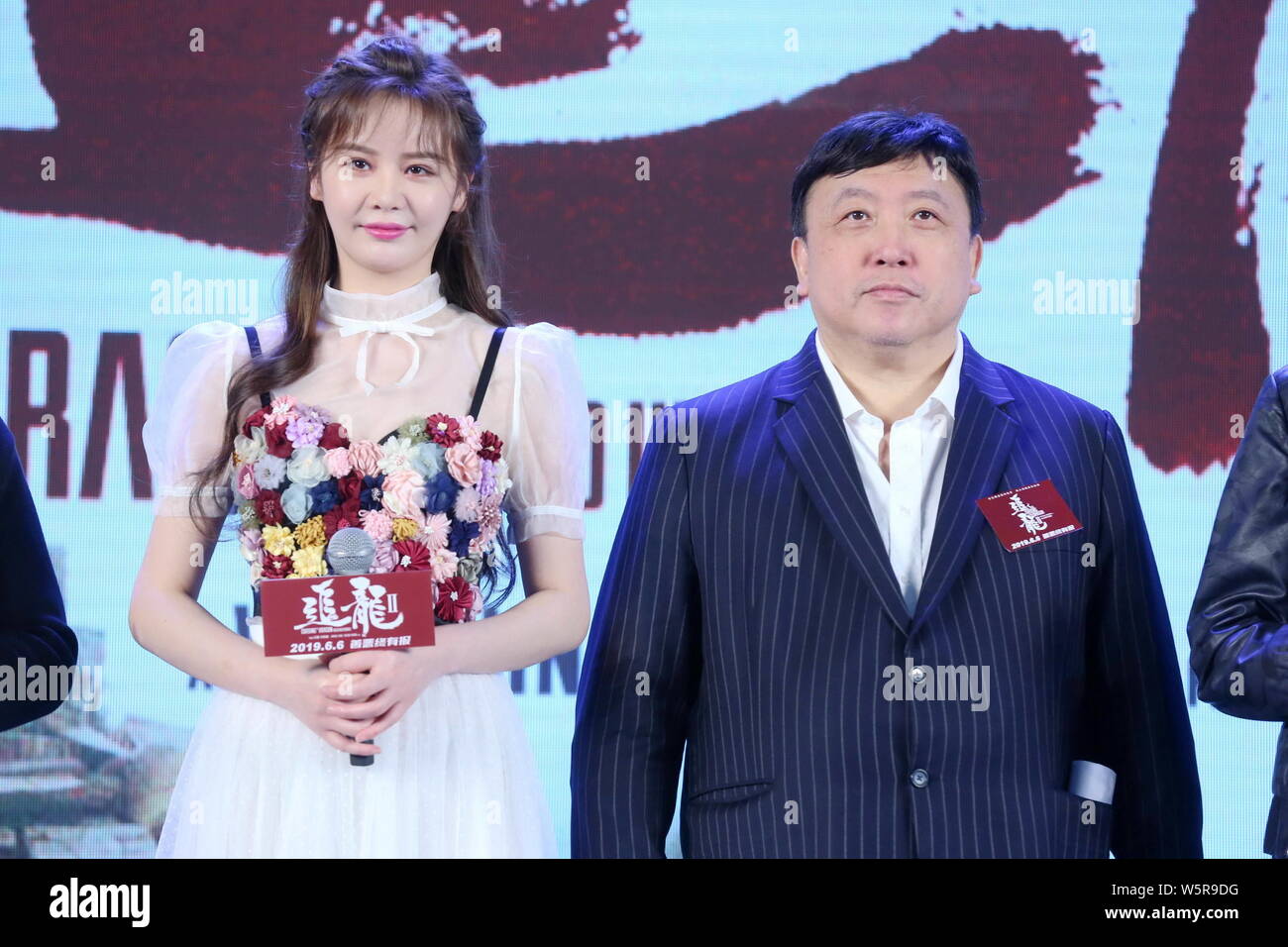 Hong Kong film director and actor Wong Jing, right, and Chinese actress ...
