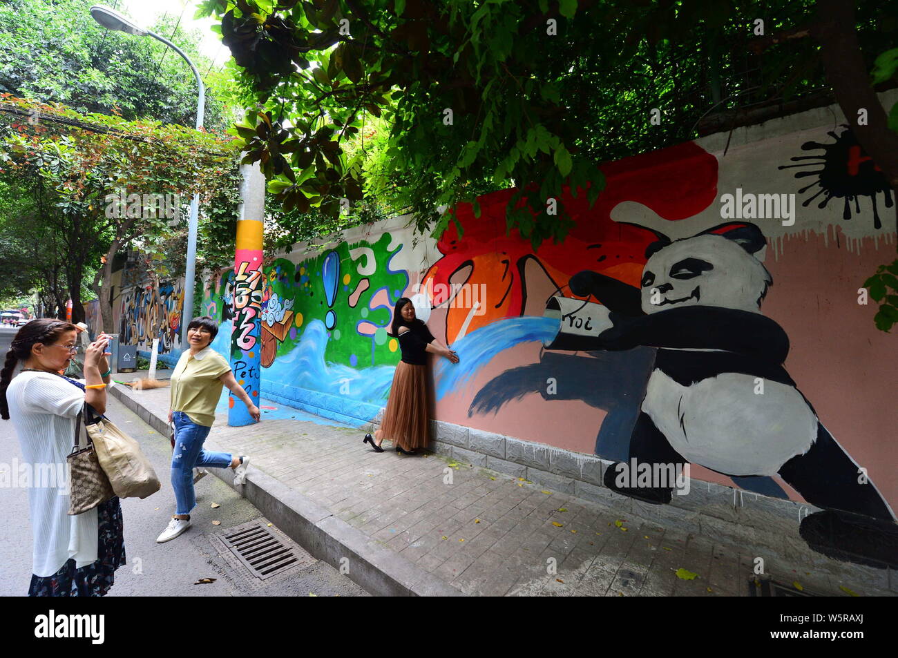 Colorful wall paintings feature giant pandas in an alley in Chengdu ...
