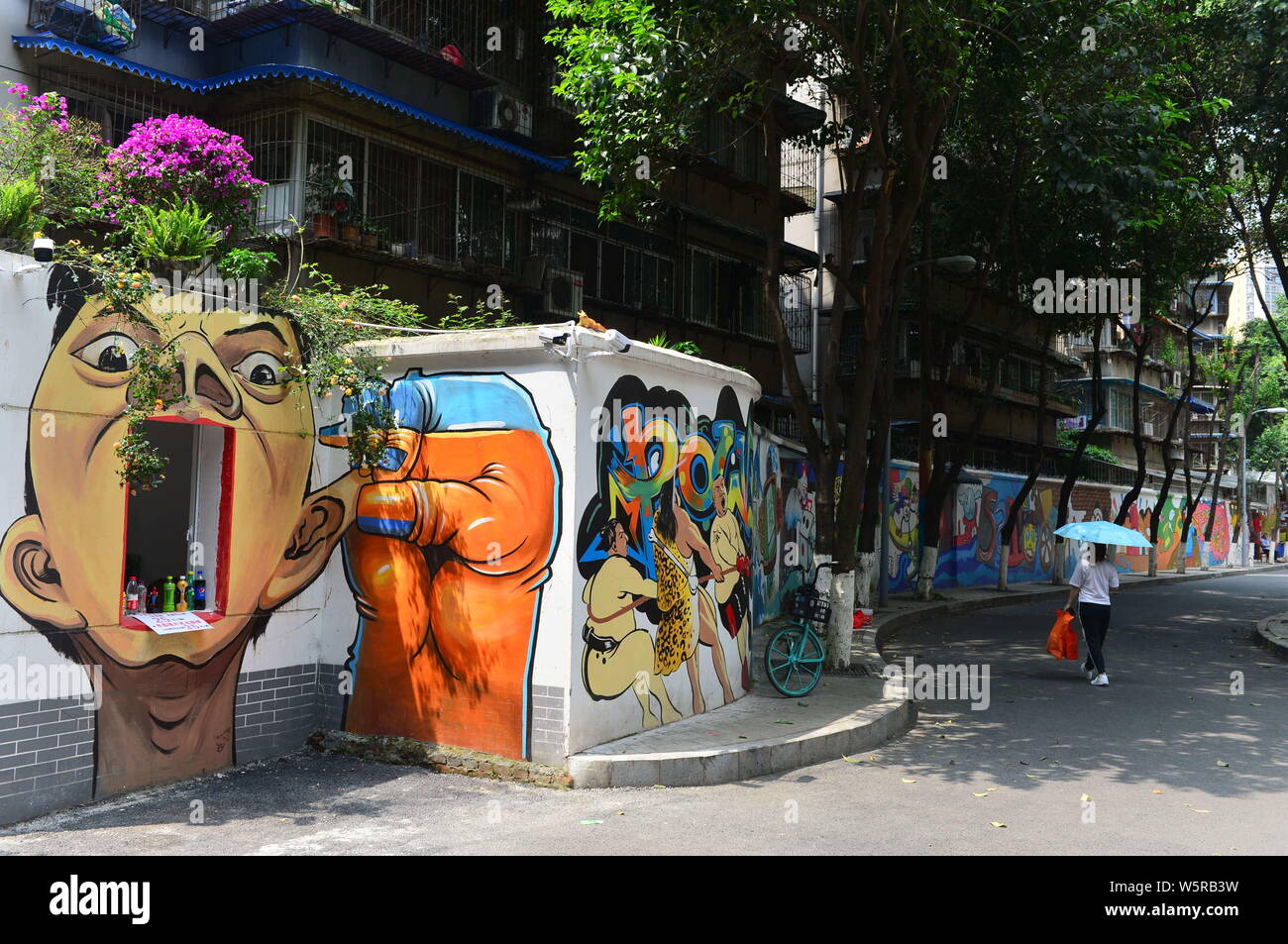 Colorful wall paintings feature giant pandas in an alley in Chengdu ...