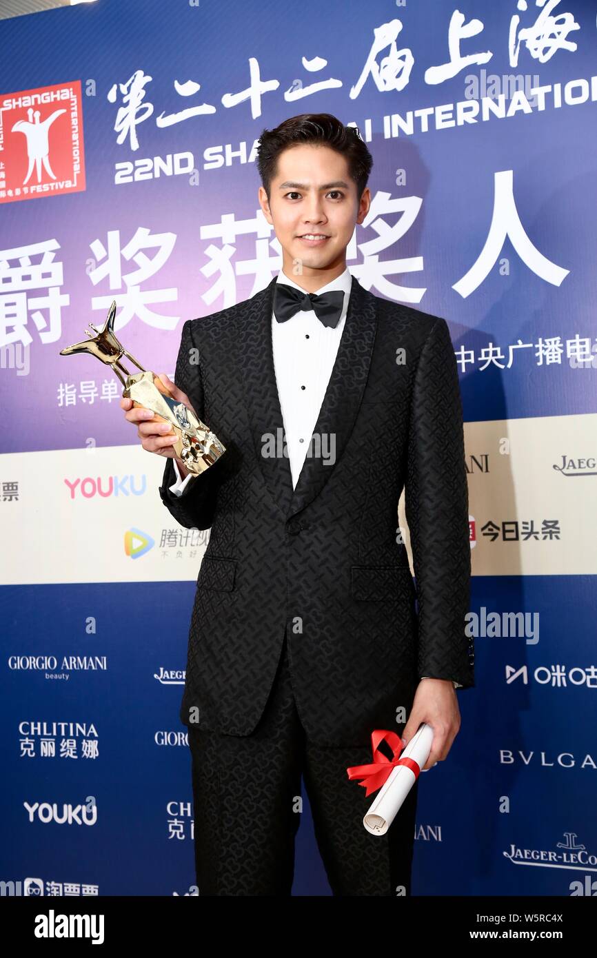 Japanese singer and actor Ryota Katayose poses with trophy after the ...