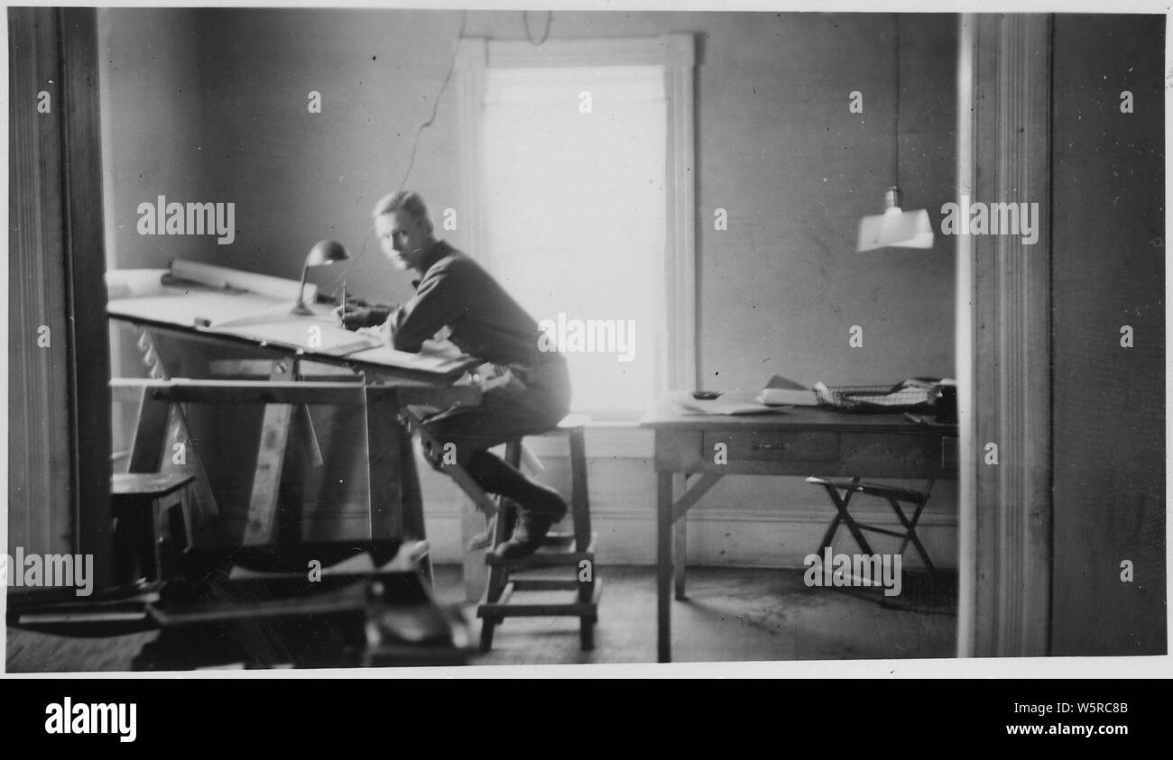 Man sitting at drafting board Stock Photo - Alamy