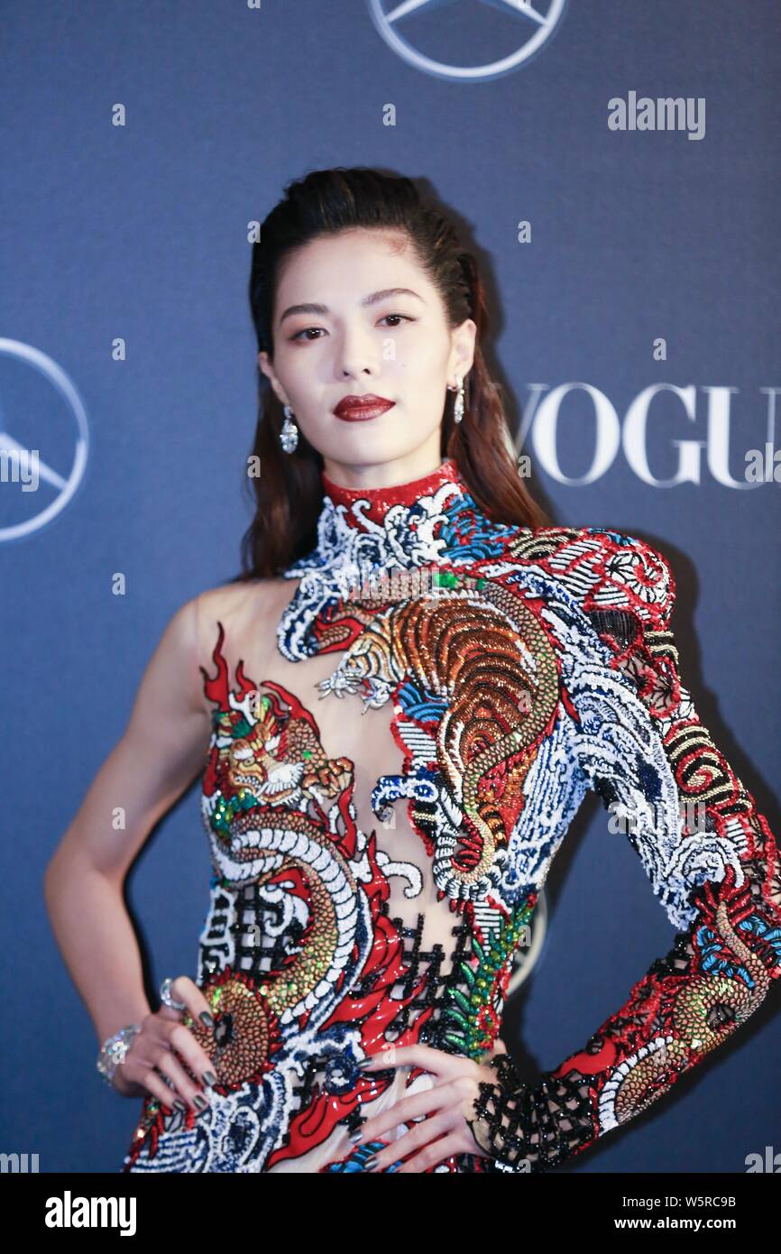 Chinese actress Zhong Chuxi poses as she arrives on the red carpet for ...