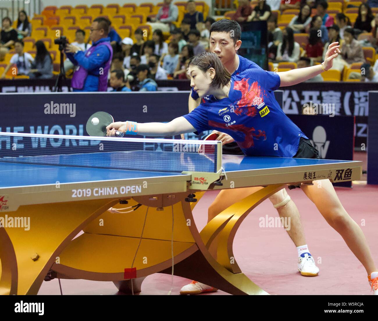 Xu Xin and Chen Meng of China return a shot to Lin Yen-jui and Cheng I-ching of Chinese Taipei ...