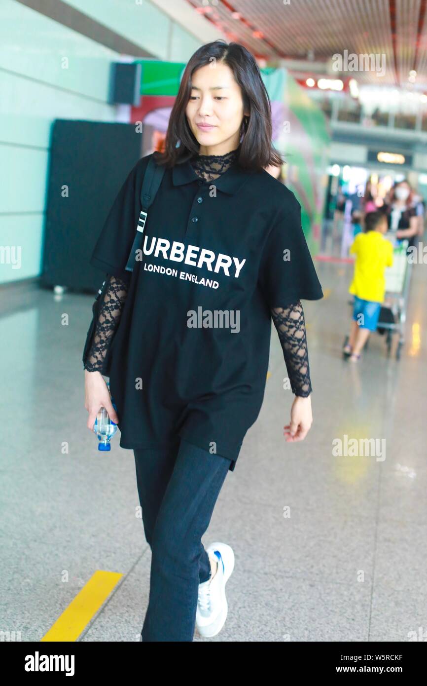 Chinese supermodel Liu Wen arrives at the Beijing Capital International ...