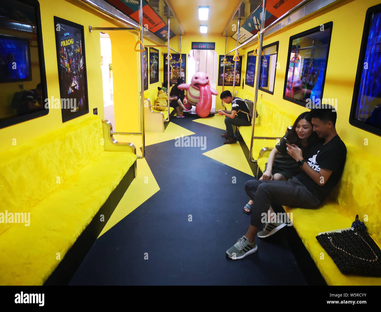 Customers enjoy themselves in a subway train-shaped rest room featuring ...